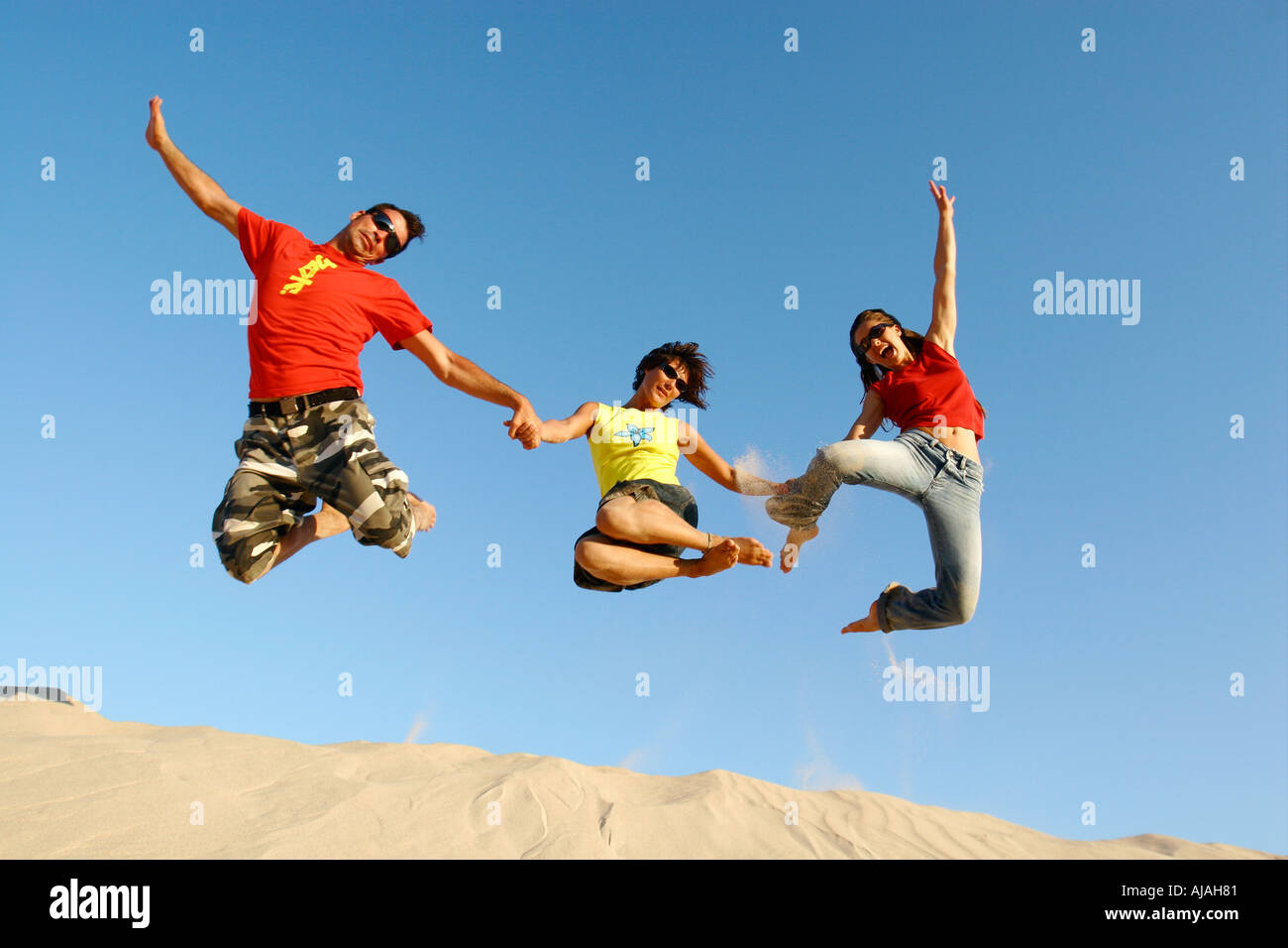 Man jumping over female friend hi-res stock photography and images - Alamy