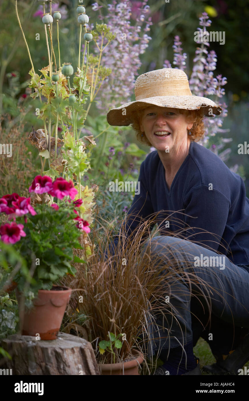 Woman gardening model released Dorset England UK Stock Photo - Alamy