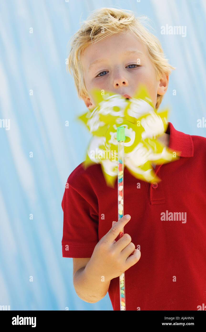 Boy playing with pin wheel Stock Photo - Alamy