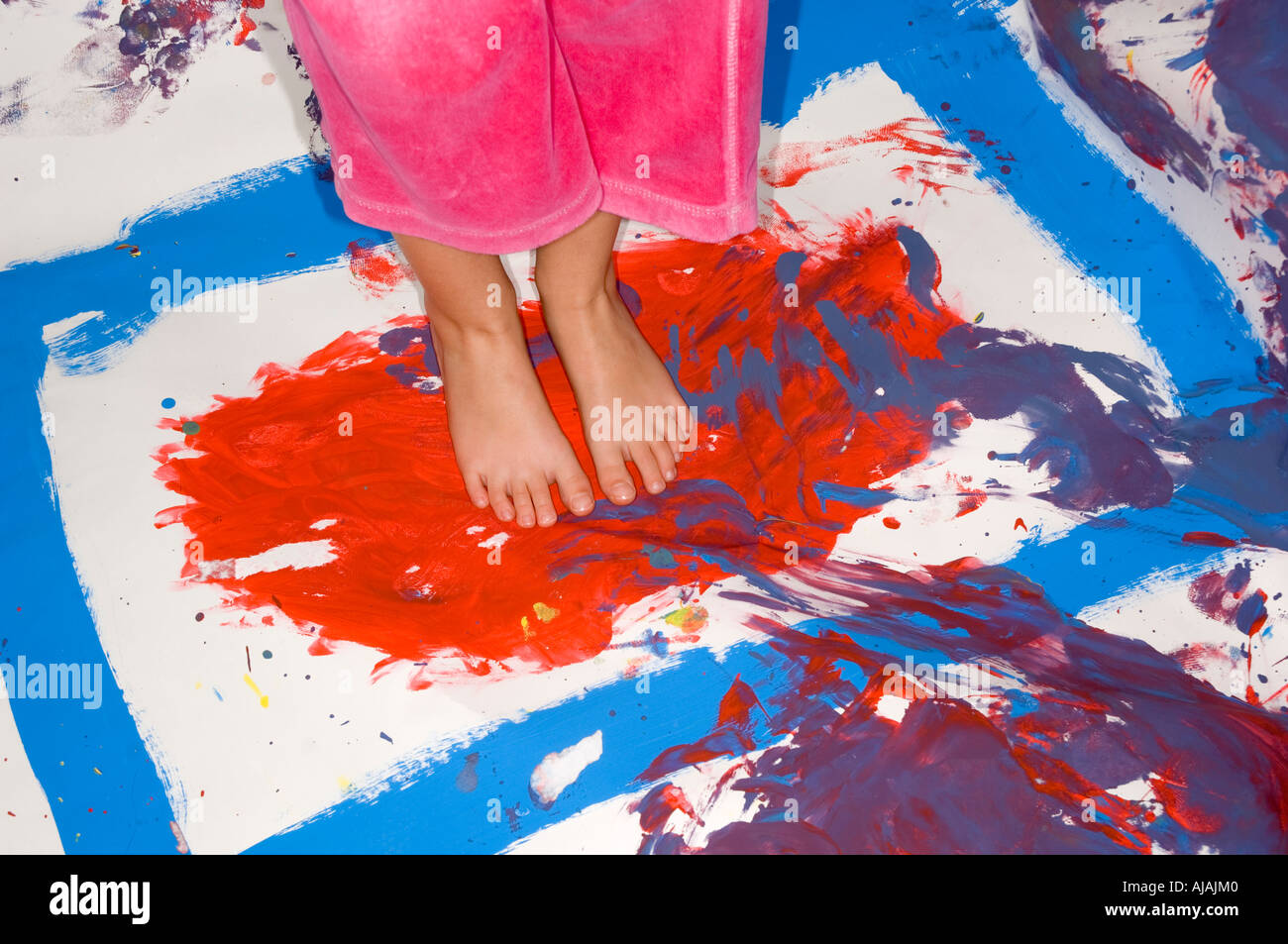 Girls feet with paint Stock Photo - Alamy