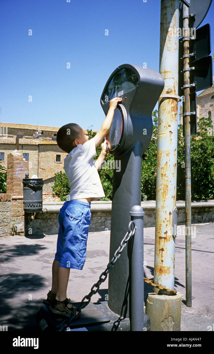Volterra boy taking his weight on street balance Stock Photo - Alamy