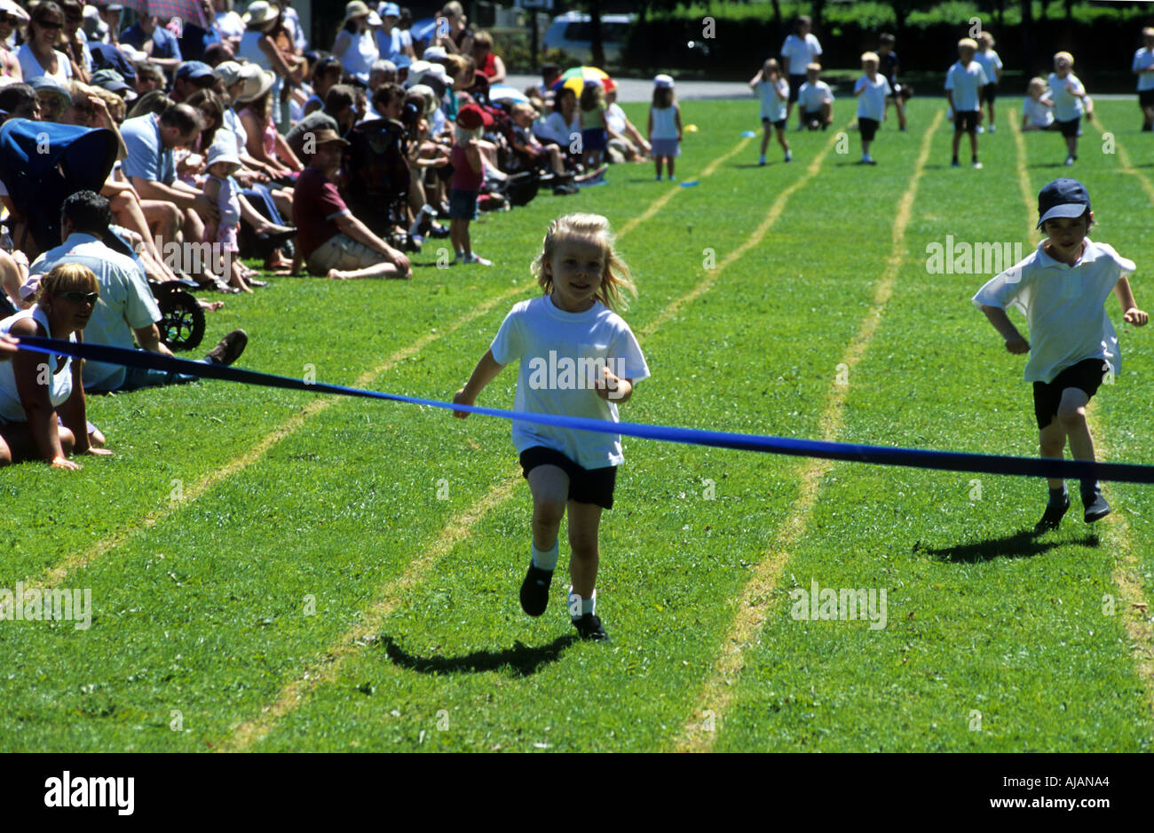 Schoolgirl winning school sports day race Stock Photo - Alamy