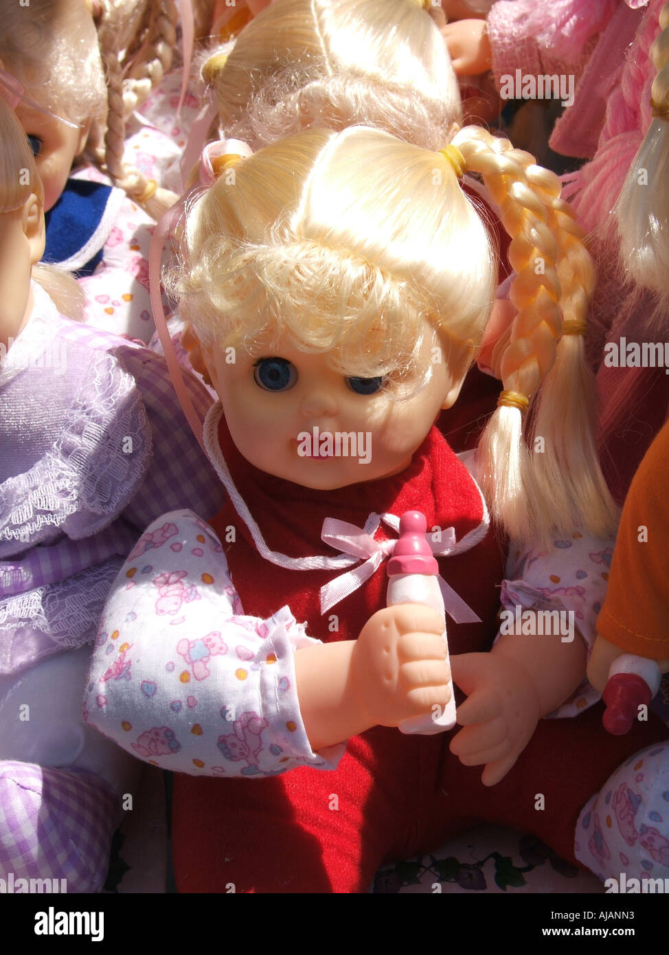 lots of baby dolls on market stall Stock Photo - Alamy