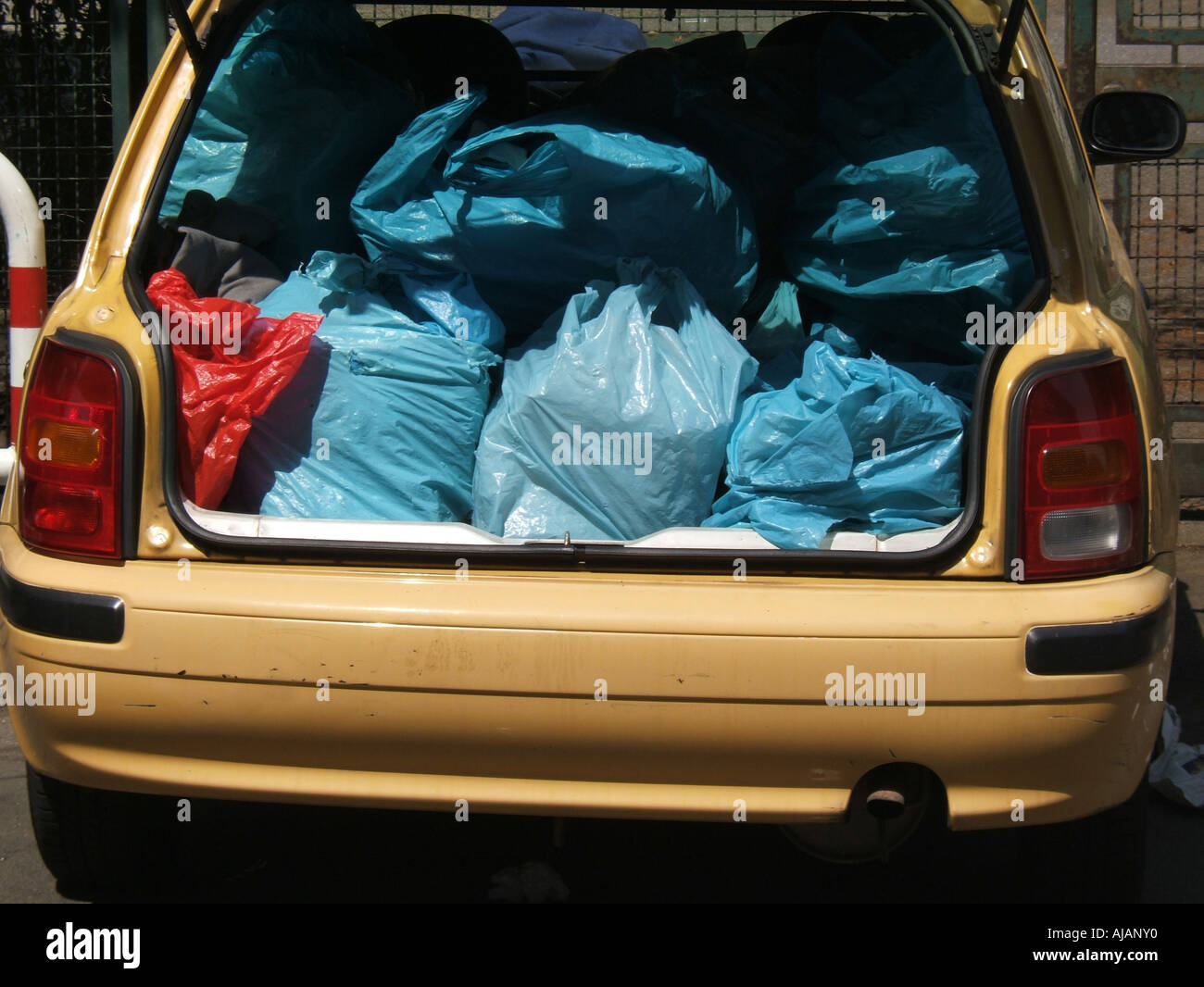 car boot full of blue plastic carrier bags Stock Photo - Alamy