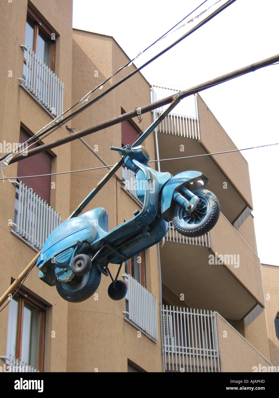 one vespa motorbike hanging outside mechanic's workshop in rome Stock ...