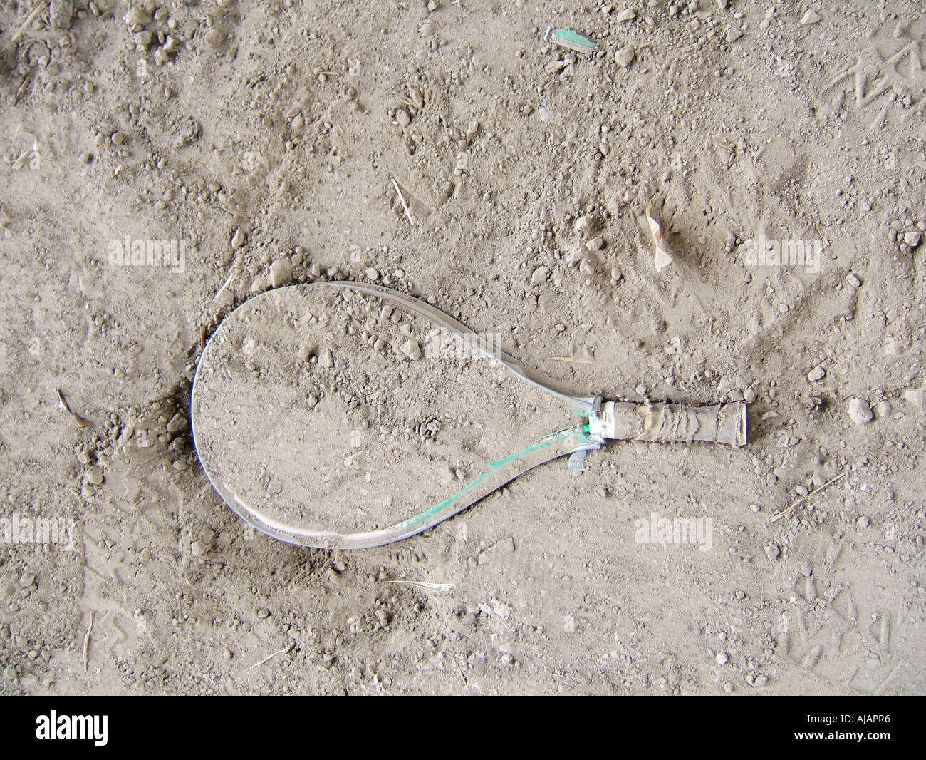 tennis racquet left in soil Stock Photo - Alamy