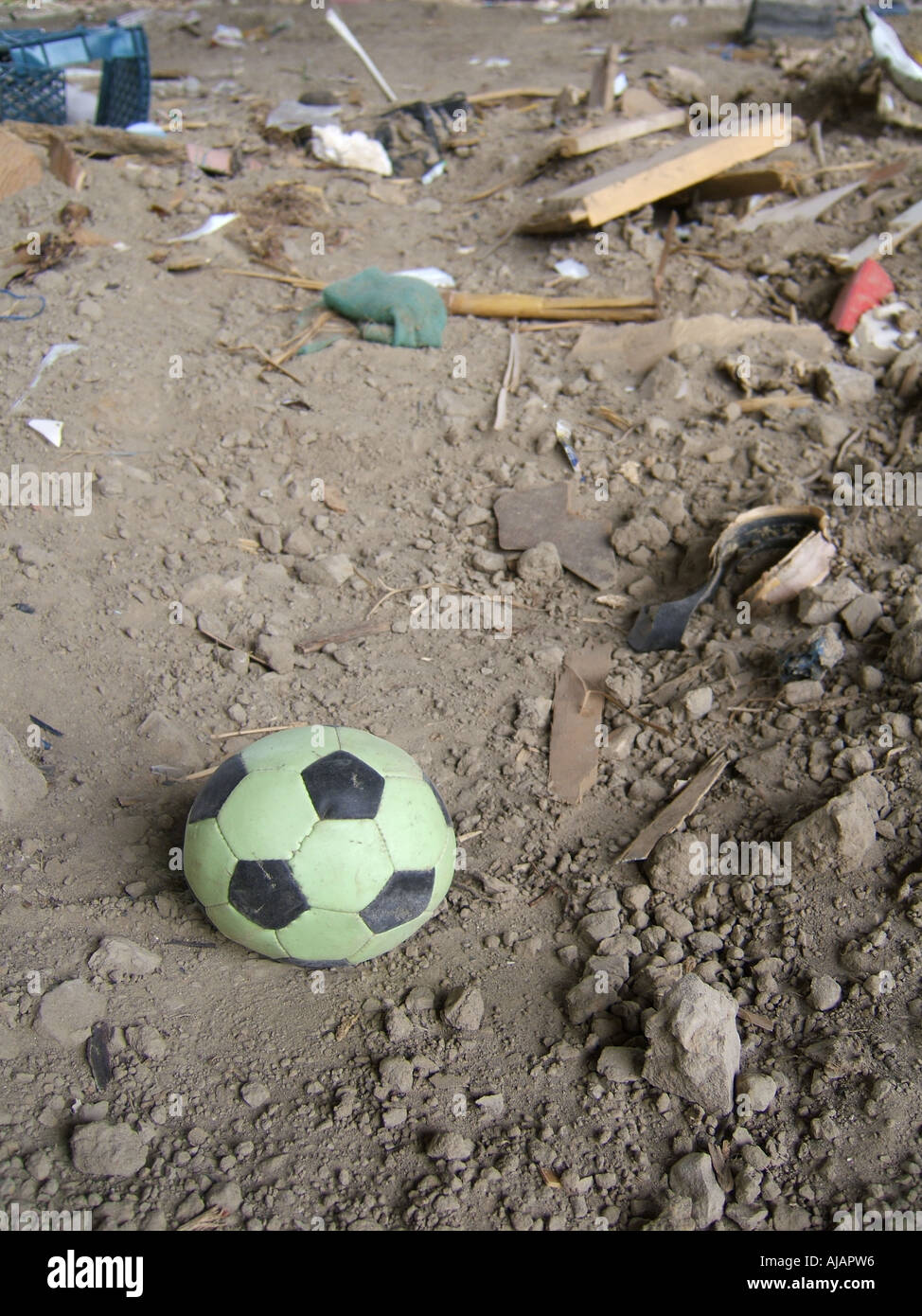 one dirty football on derelict ground Stock Photo - Alamy