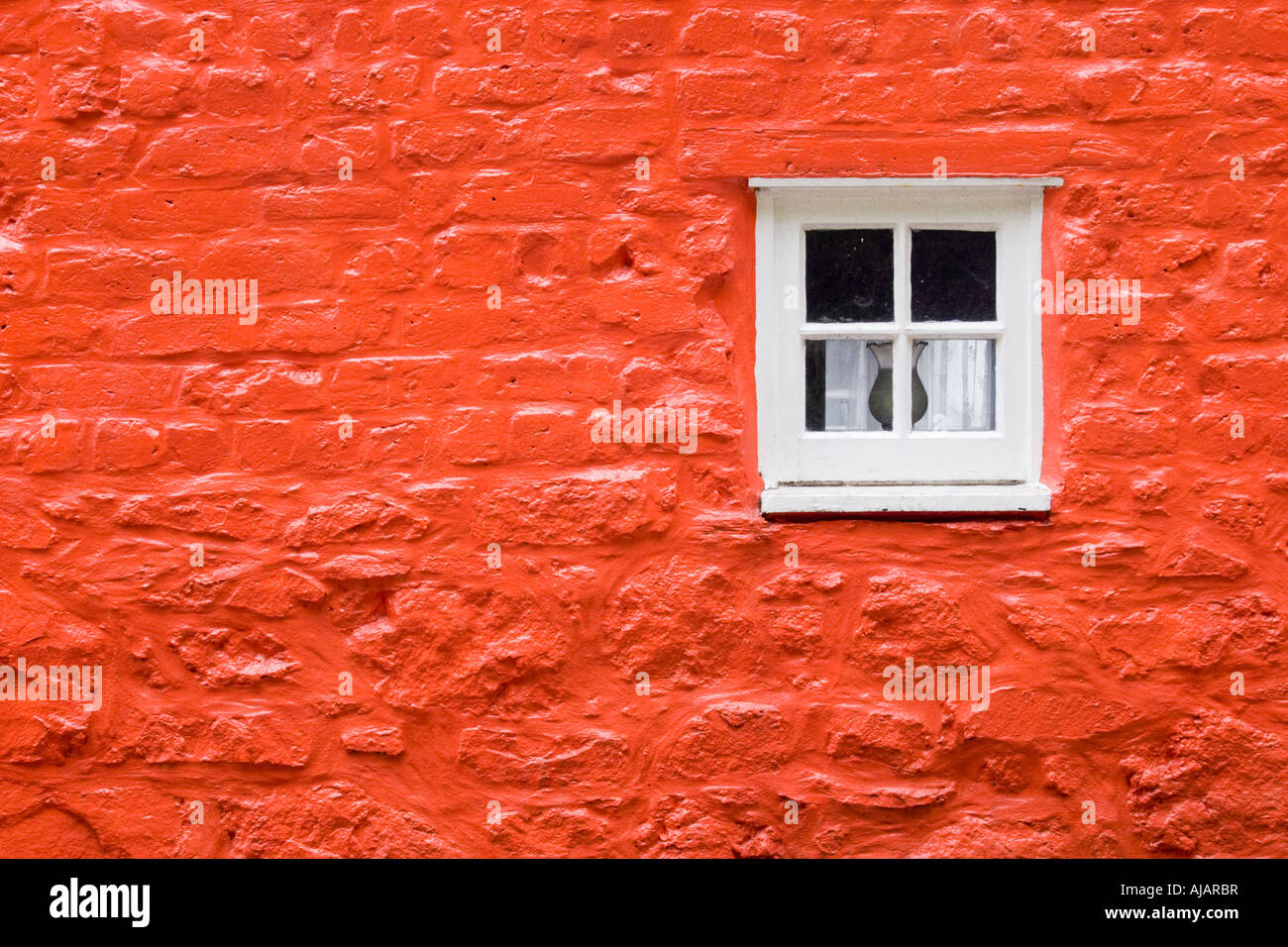 Window in bright red house Stock Photo - Alamy
