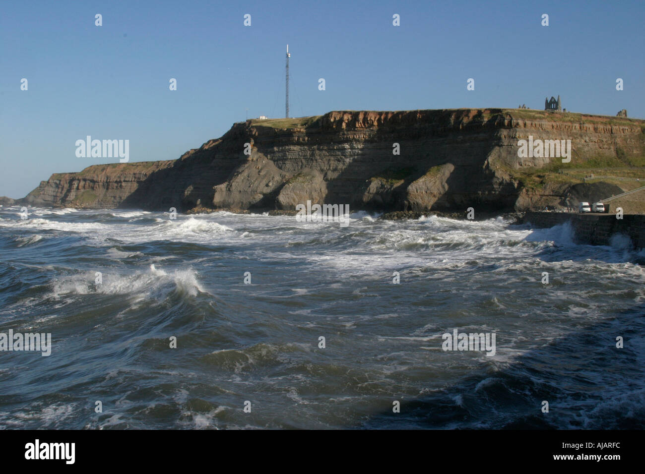 Waves and cliffs at Whitby East Yorkshire Coast Stock Photo - Alamy