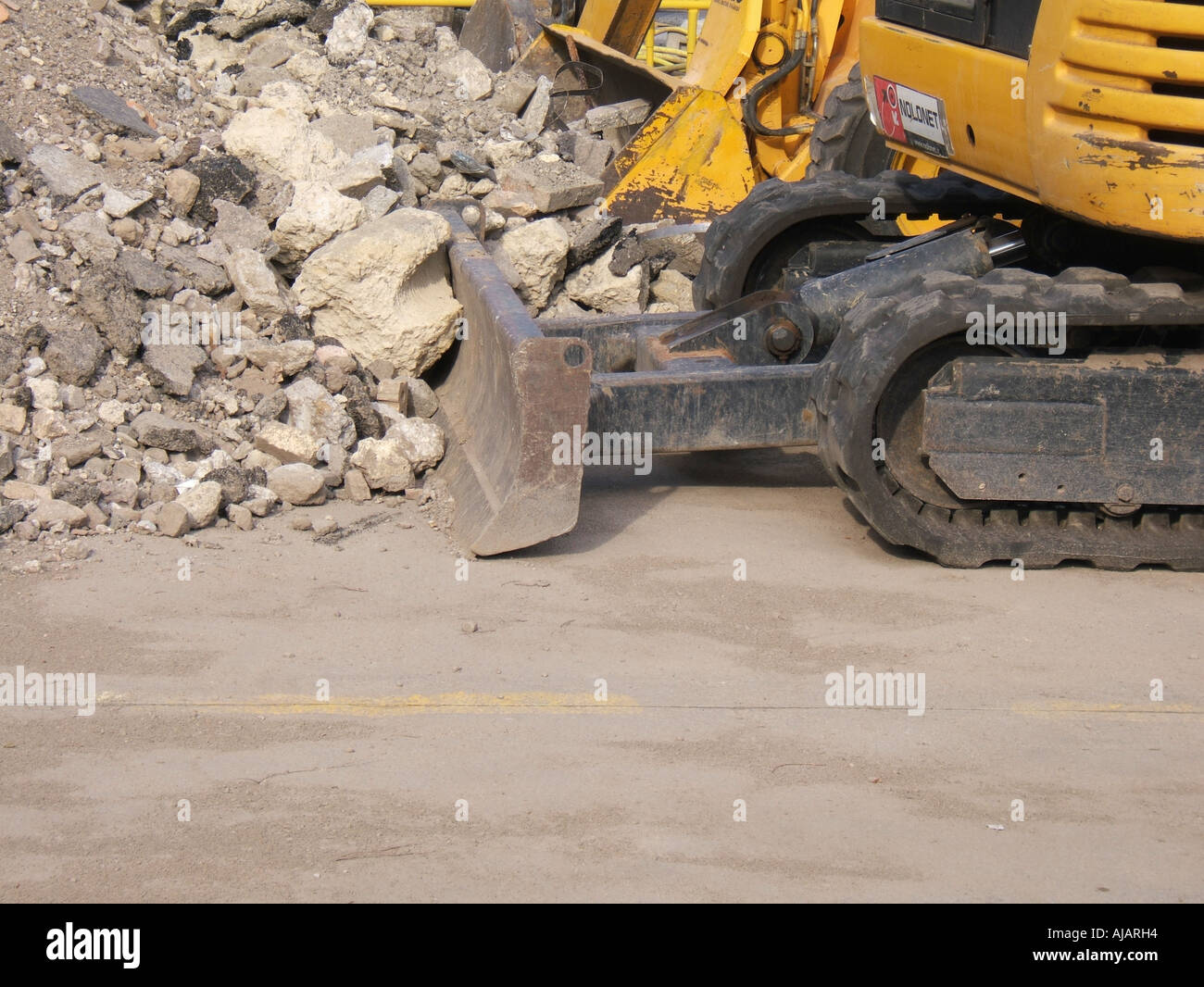 bulldozer removing rubble Stock Photo - Alamy