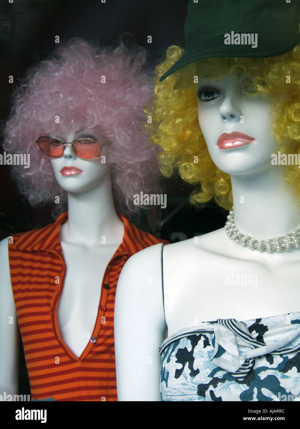 female mannequins with colourful clothes in shop window Stock Photo - Alamy
