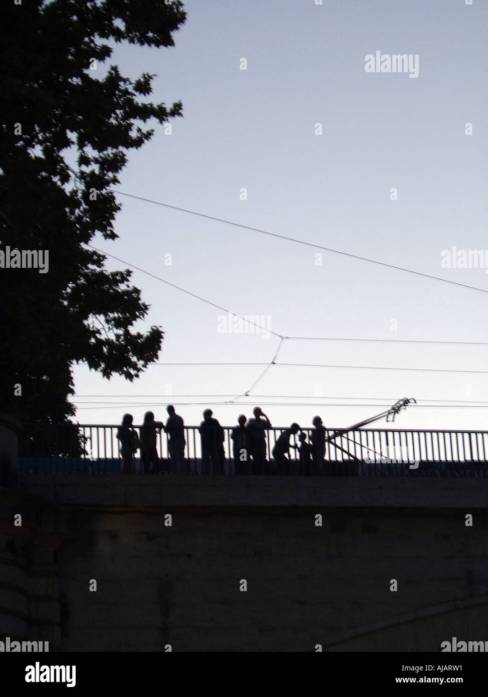 people crossing bridge at night Stock Photo - Alamy
