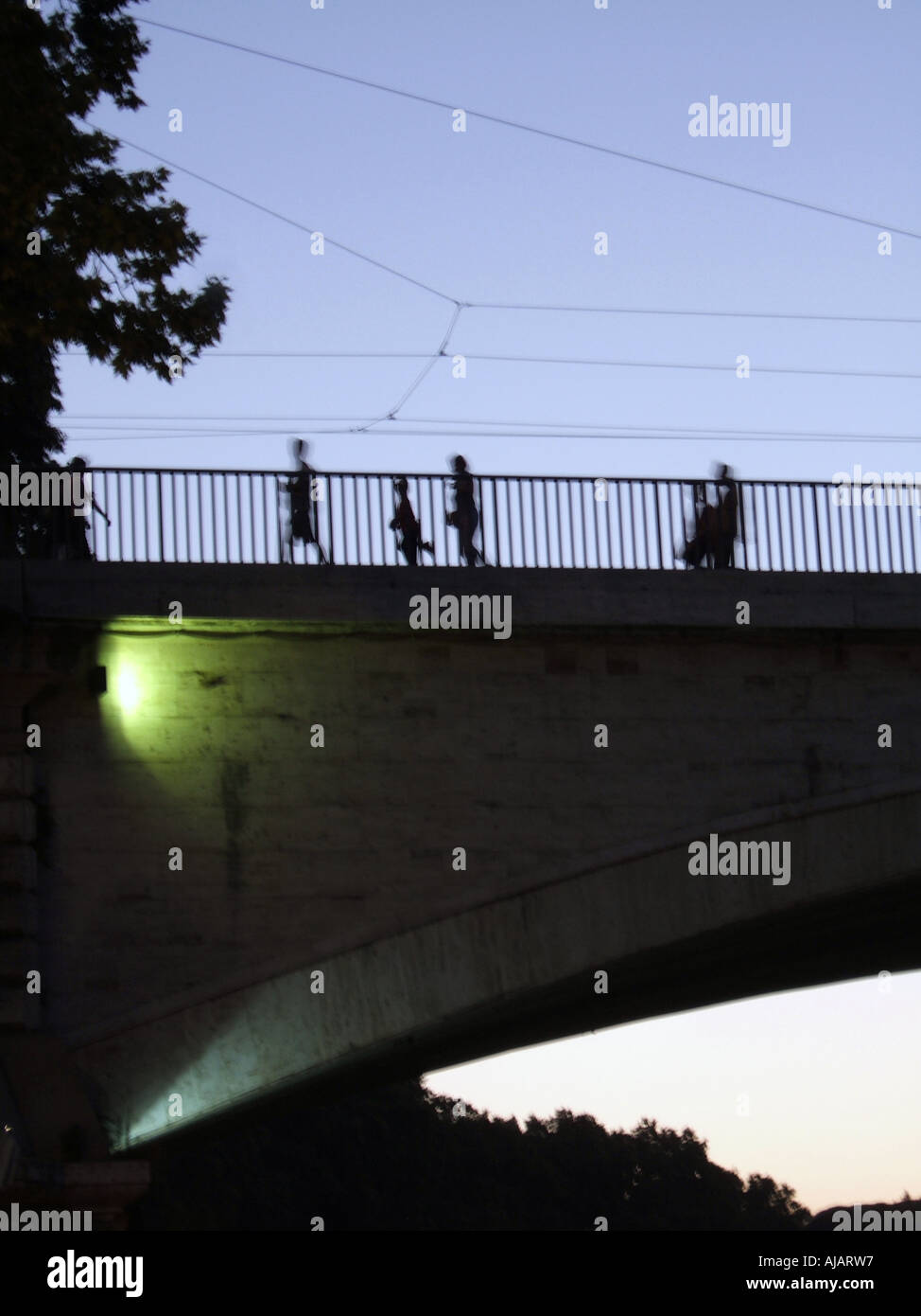 people crossing bridge at night Stock Photo - Alamy