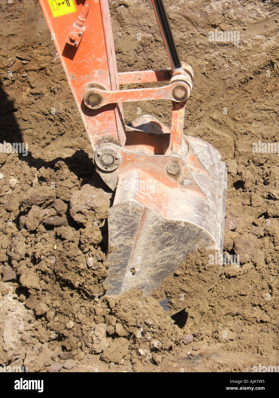 mechanical digger digging hole Stock Photo - Alamy