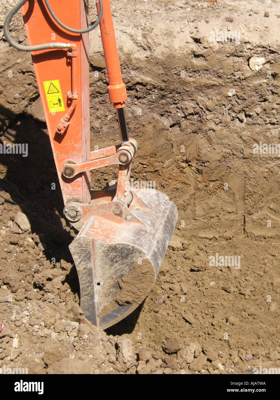 mechanical digger digging hole Stock Photo - Alamy