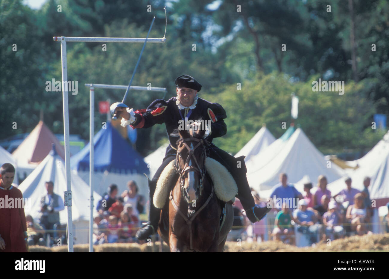 Skills at arms event lancing rings with a sword Stock Photo - Alamy