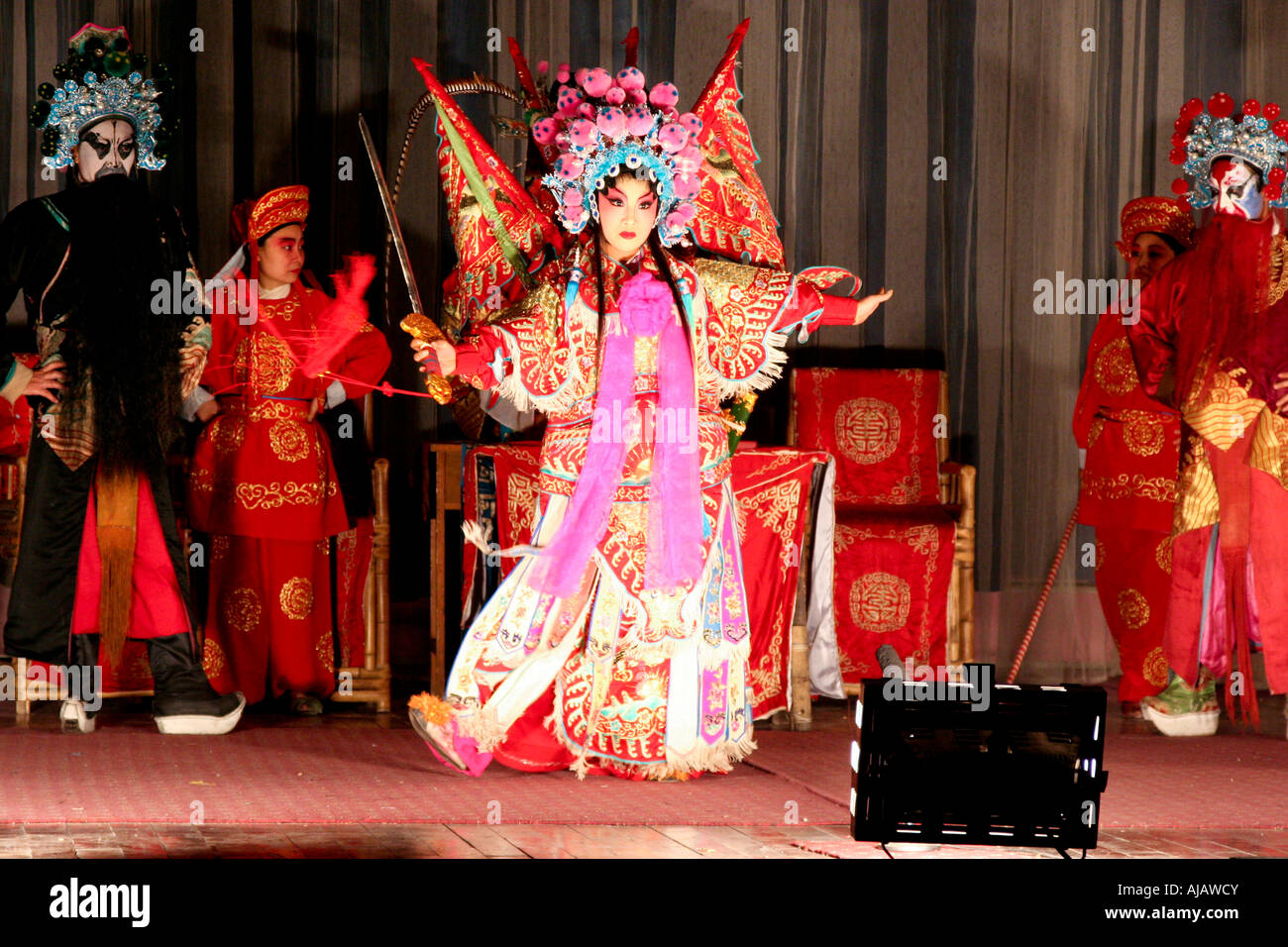 Actors of the Chengdu Opera dressed in traditional clothing performing ...