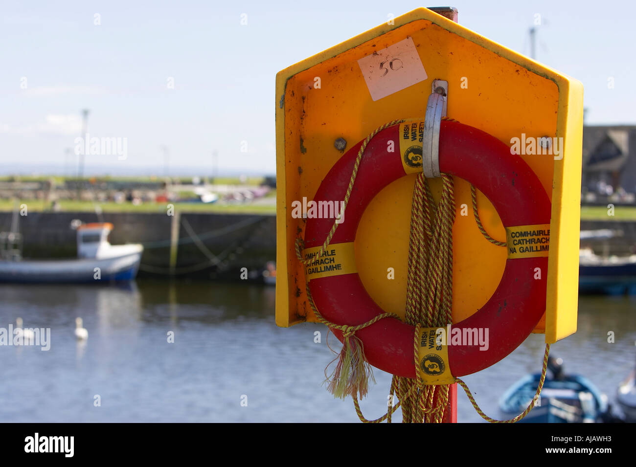 irish water safety life belt with bilingual english and gaelic signs on ...