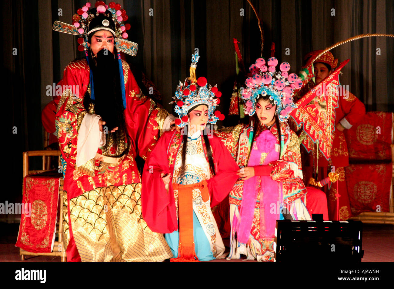 Actors of the Chengdu Opera dressed in traditional clothing performing ...