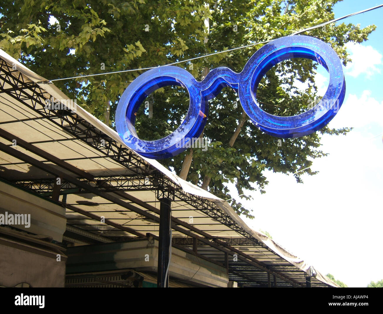blue neon spectacles sign Stock Photo - Alamy