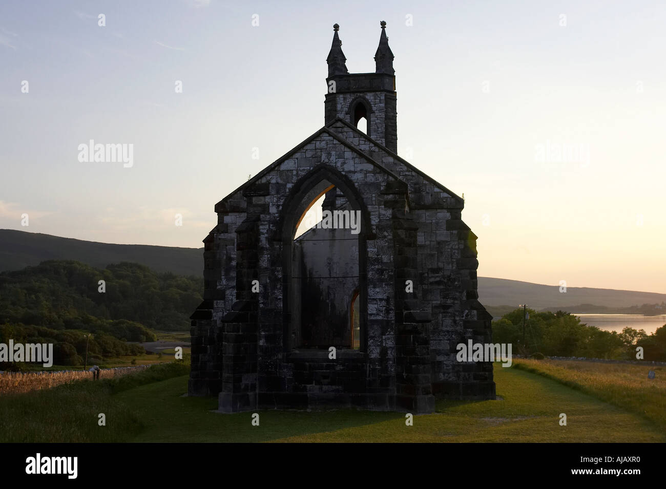 dunlewey church of ireland protestant church silhouetted at sunset ...