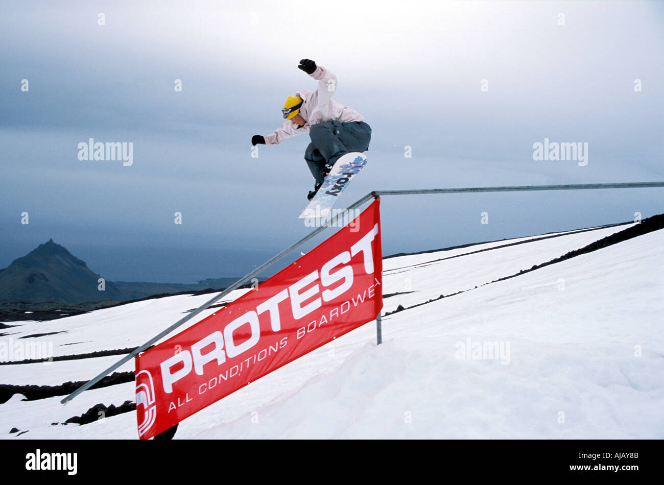 Snowboard girl performing a snowboard trick in Iceland Stock Photo - Alamy