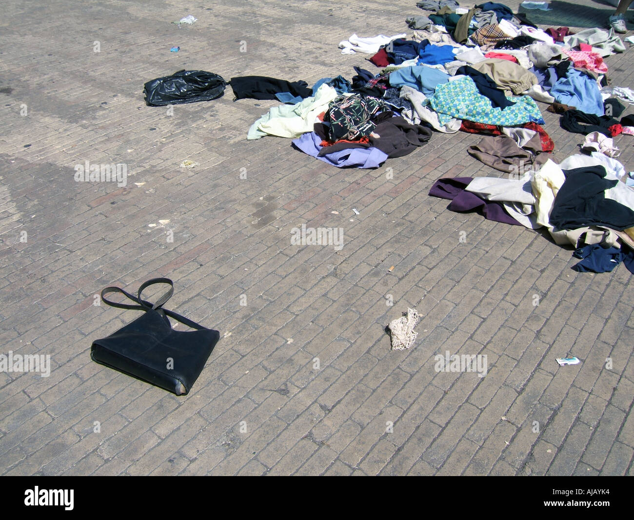 pile of old clothes left on street Stock Photo - Alamy