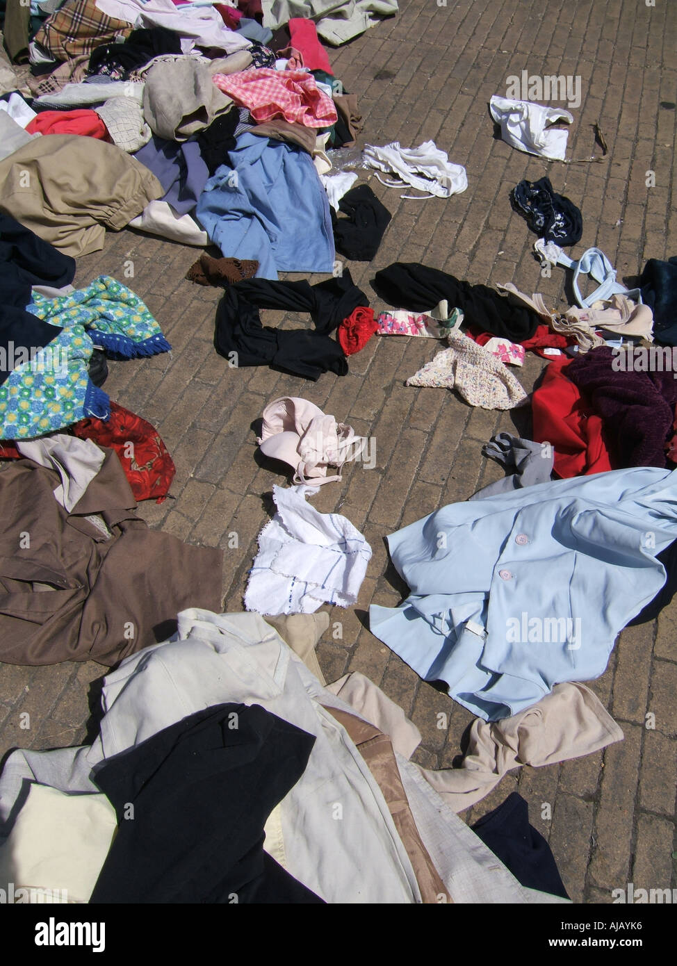 pile of old clothes left on street Stock Photo - Alamy