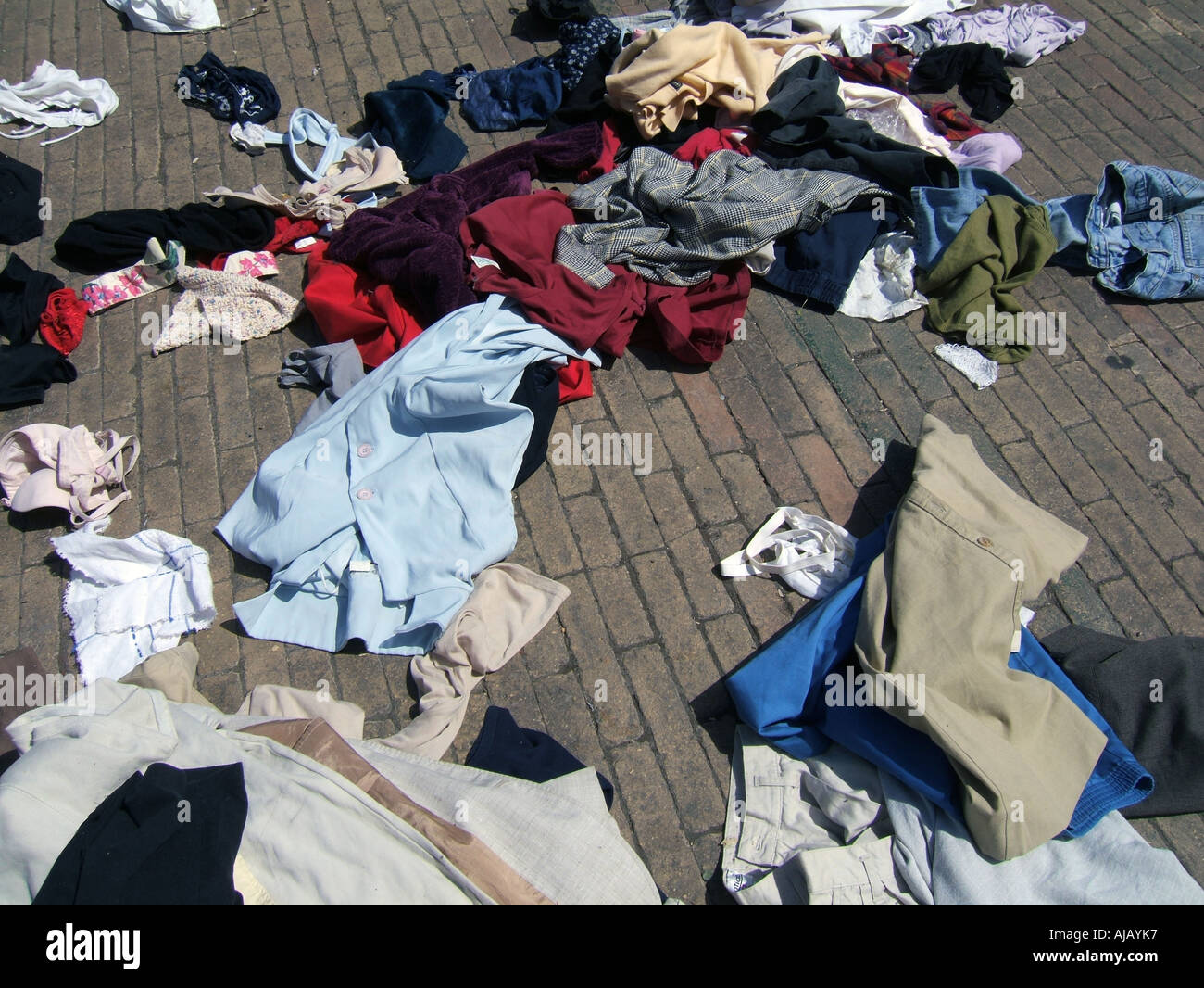 pile of old clothes left on street Stock Photo - Alamy