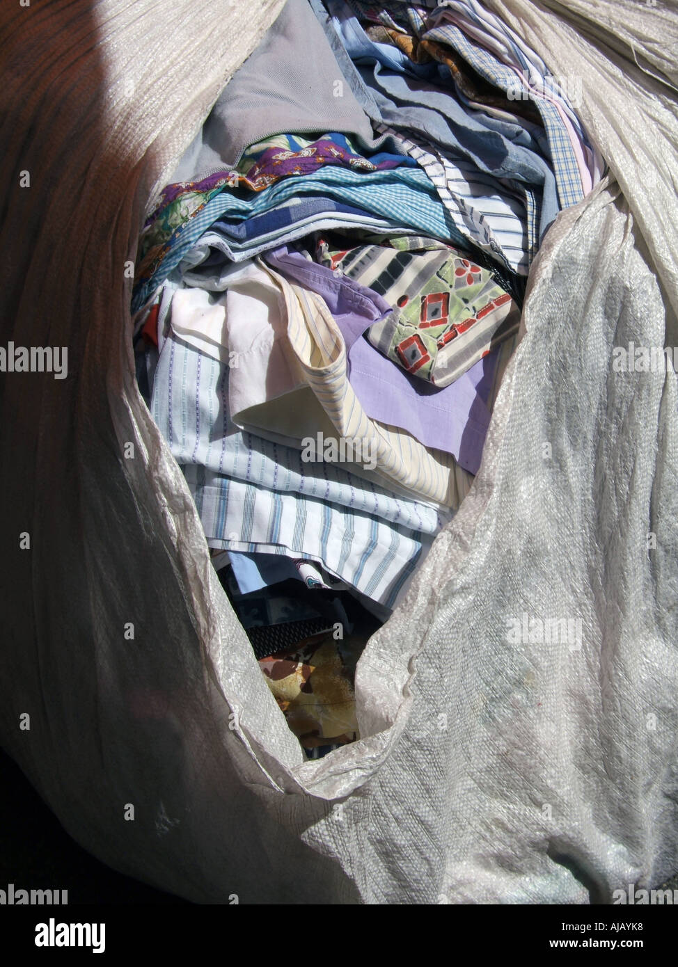 pile of clothes packed in a sack Stock Photo - Alamy