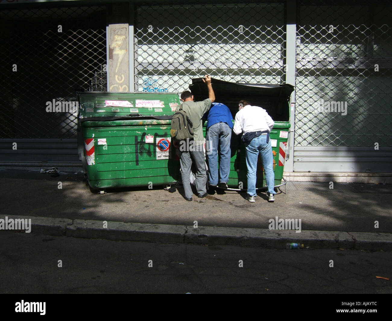 people searching through bins at porta portese market in rome Stock ...