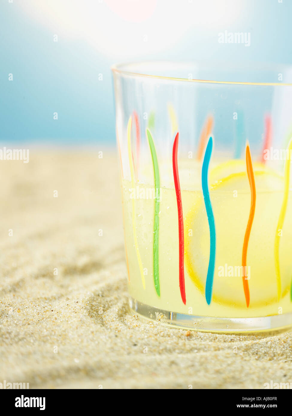 Glass of Lemonade on Beach Stock Photo - Alamy