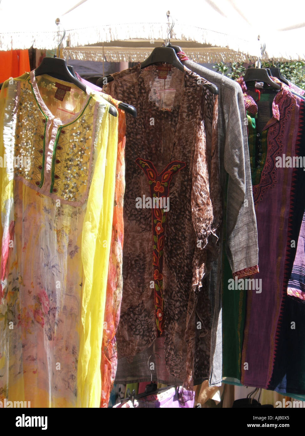 colourful ethnic dresses on market stall Stock Photo - Alamy