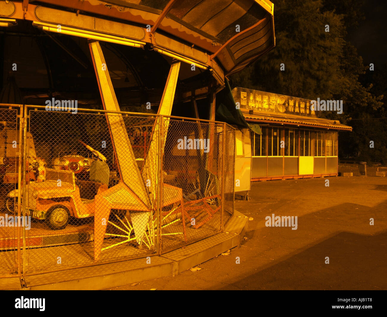 derelict type fairground at night Stock Photo - Alamy