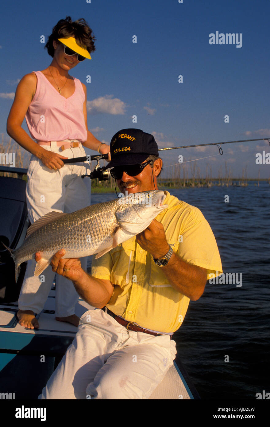 Fishing saltwater, red drum, red fish, couple holding large redfish ...