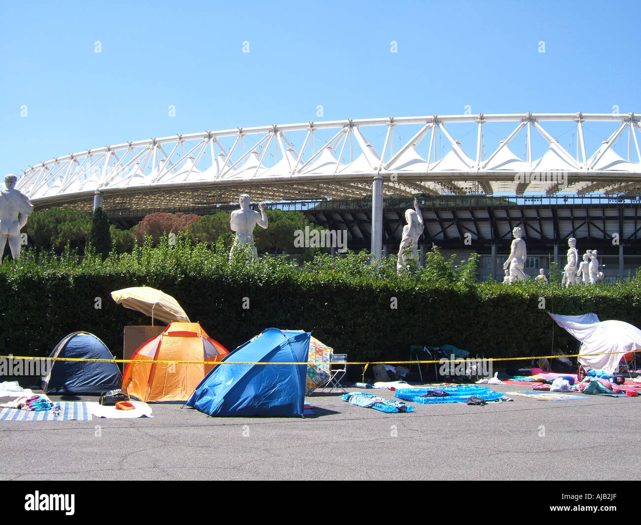 crowd of revellers sleeping rough outside entrance to madonna music ...