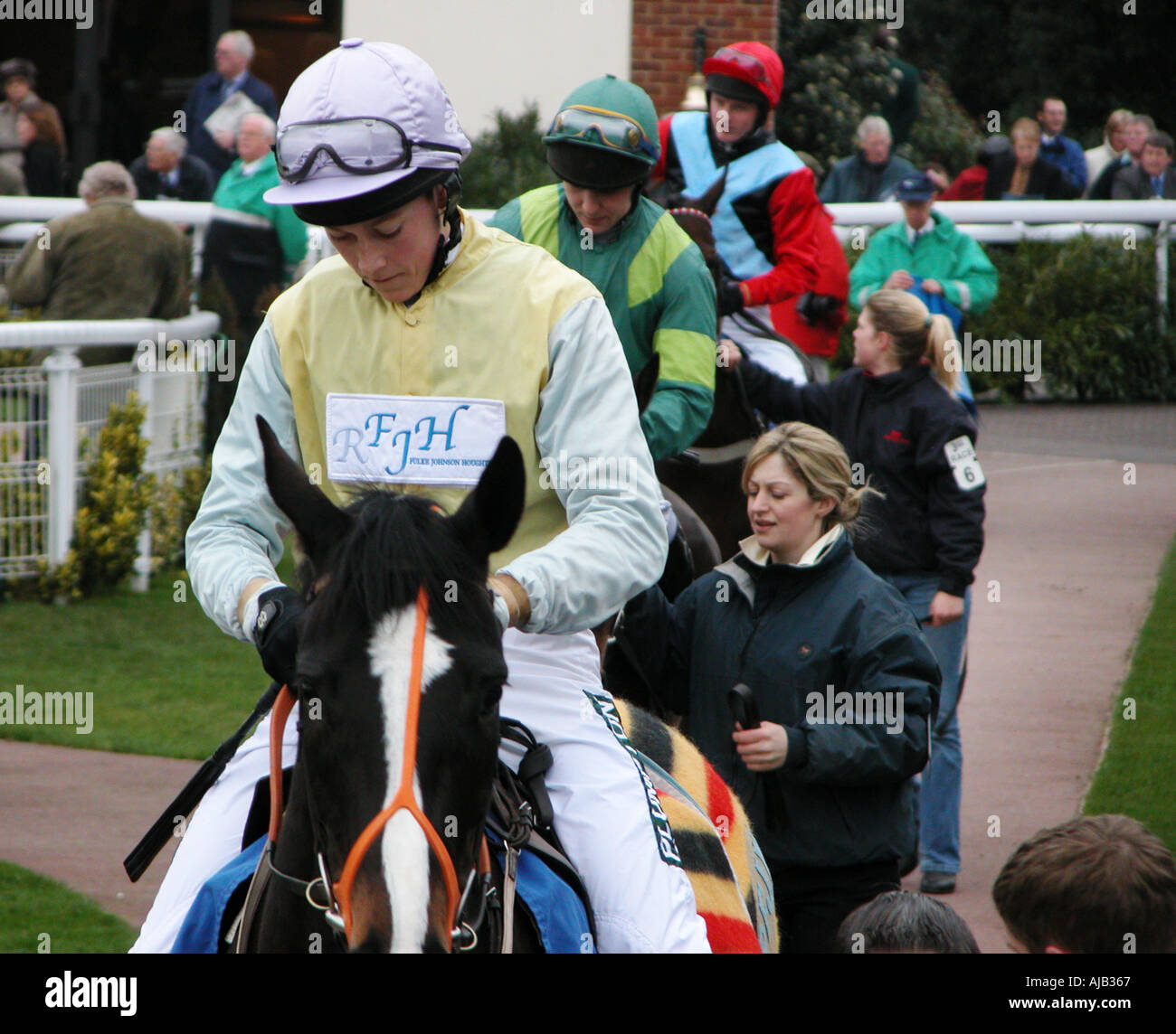 horses and jockeys in the parade ring before the race Stock Photo - Alamy