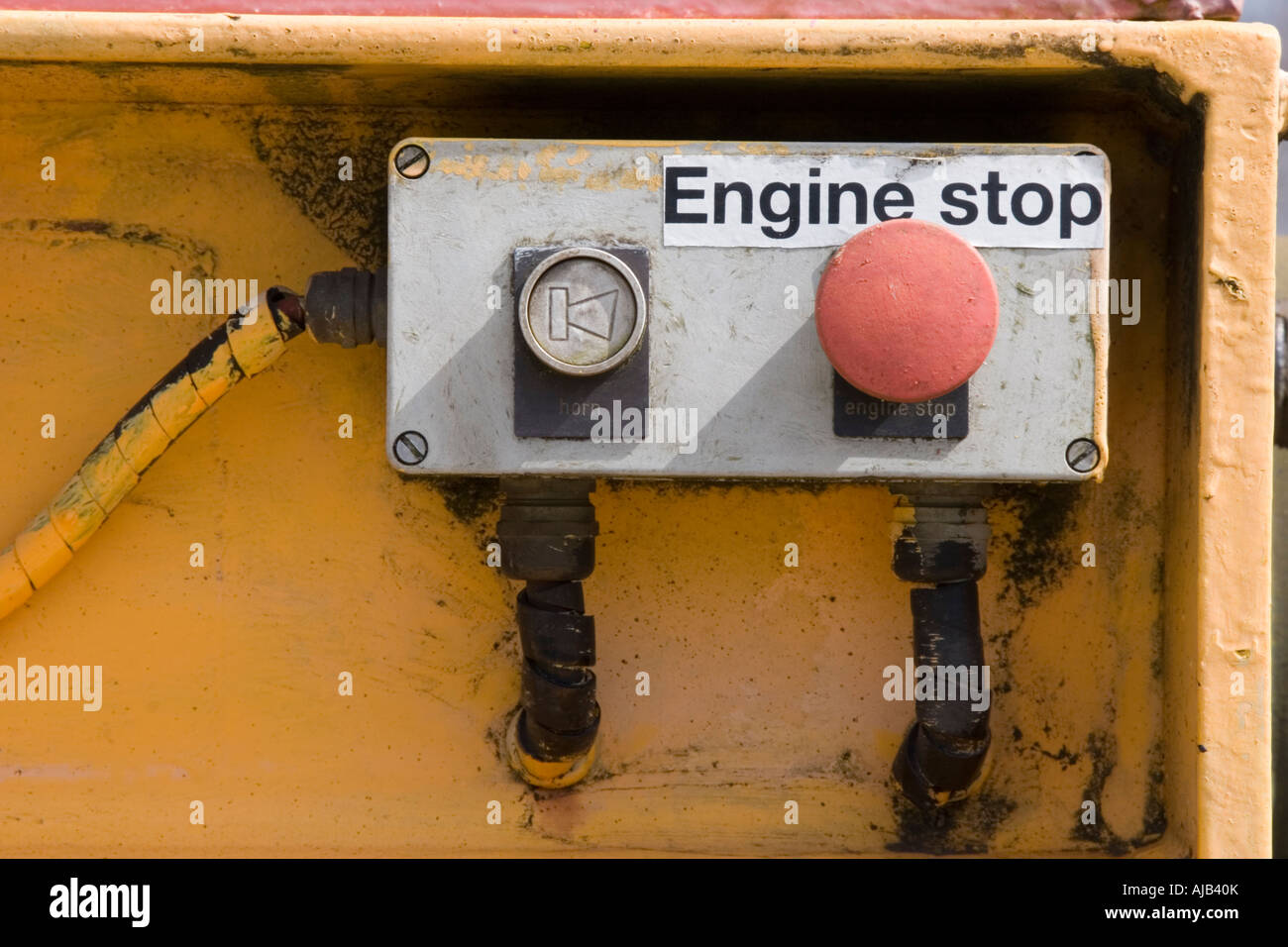 Ancient emergency engine stop buttons on neglected heavy plant ...