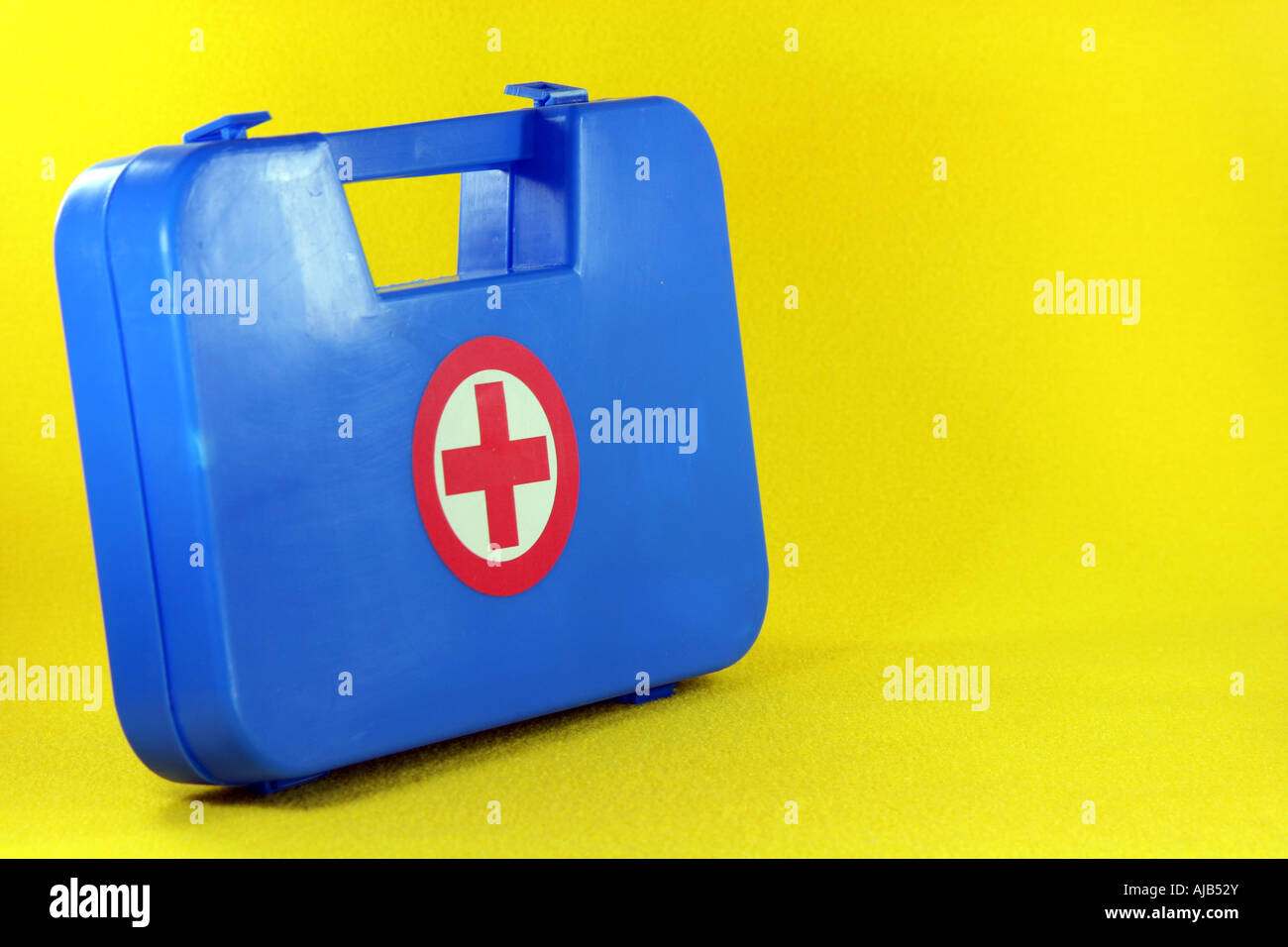 helth and safe concepts first aid box in yellow background Stock Photo ...