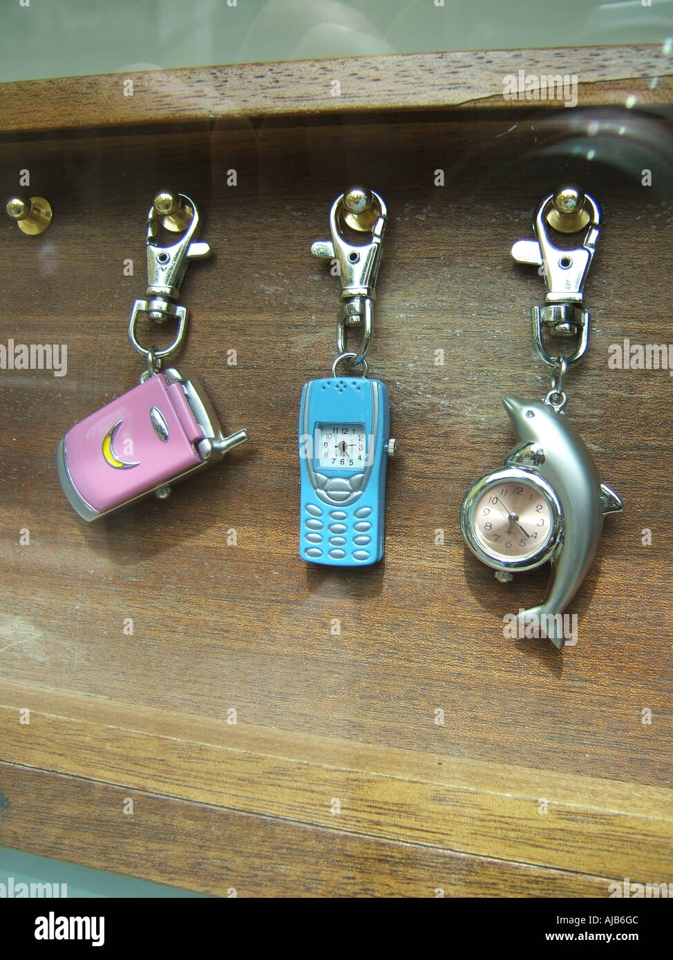 mobile phone key rings in shop window Stock Photo - Alamy