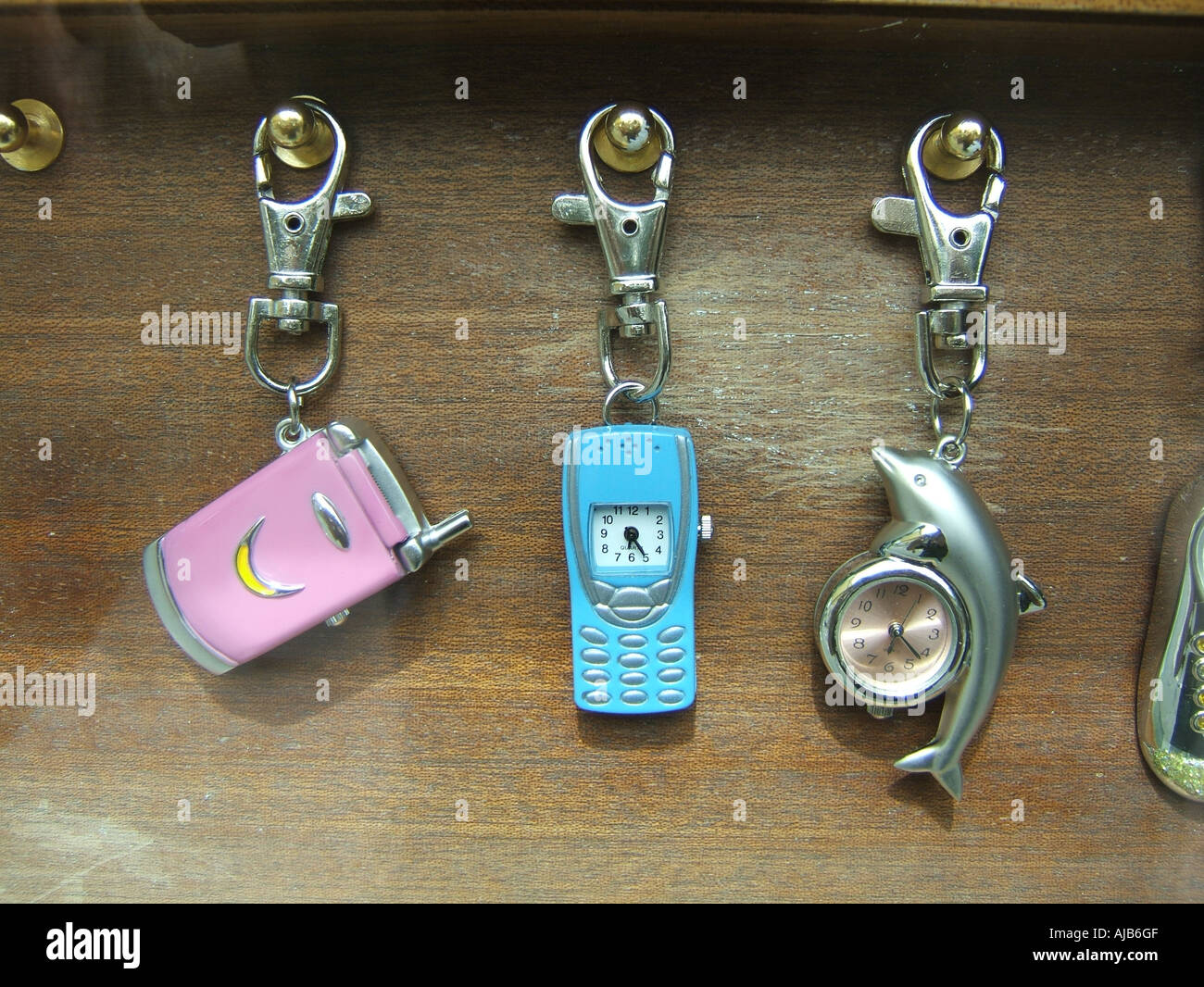 mobile phone key rings in shop window Stock Photo - Alamy