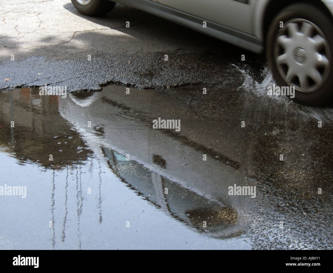 Car moving through flooded street hi-res stock photography and images ...
