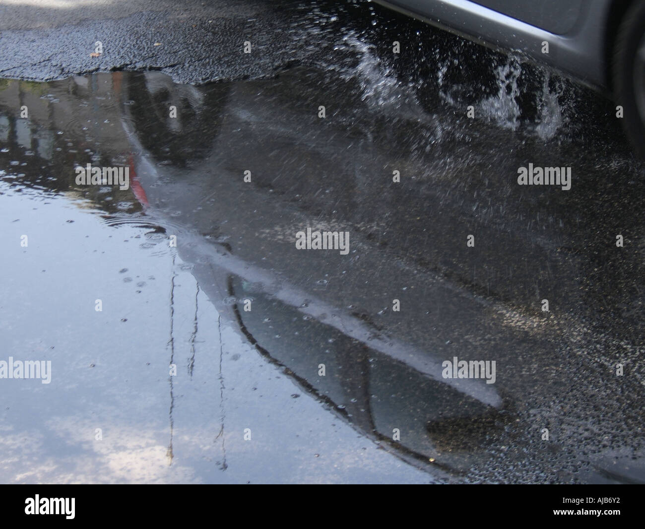 Car moving through flooded street hi-res stock photography and images ...