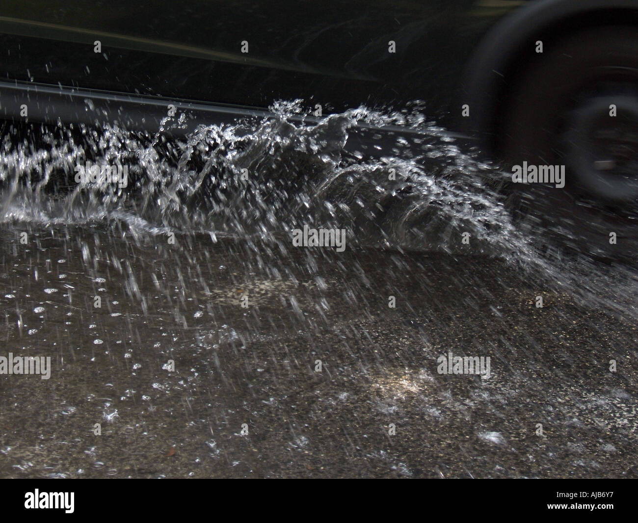 Car moving through flooded street hi-res stock photography and images ...