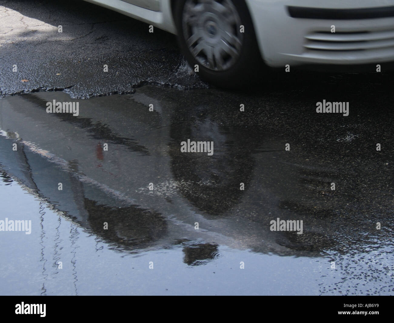 Car moving through flooded street hi-res stock photography and images ...