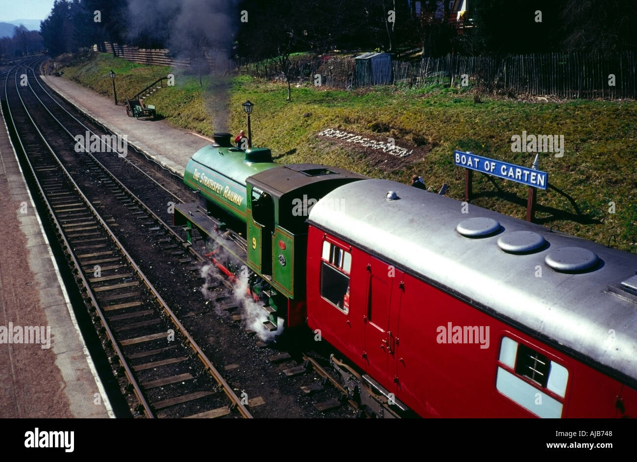steam engine pulling coaches out of boat of garten station near ...