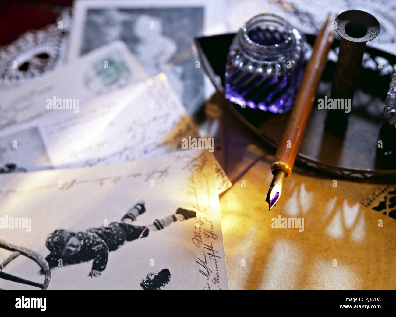 old post cards and nib and ink pots Stock Photo - Alamy