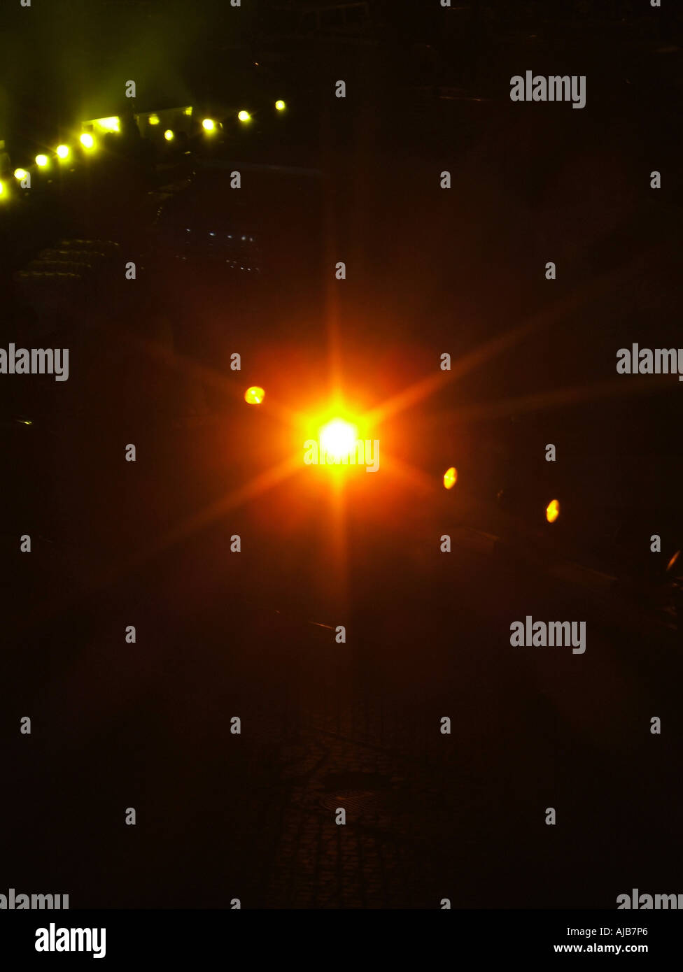 bright orange spotlight and dark background Stock Photo - Alamy