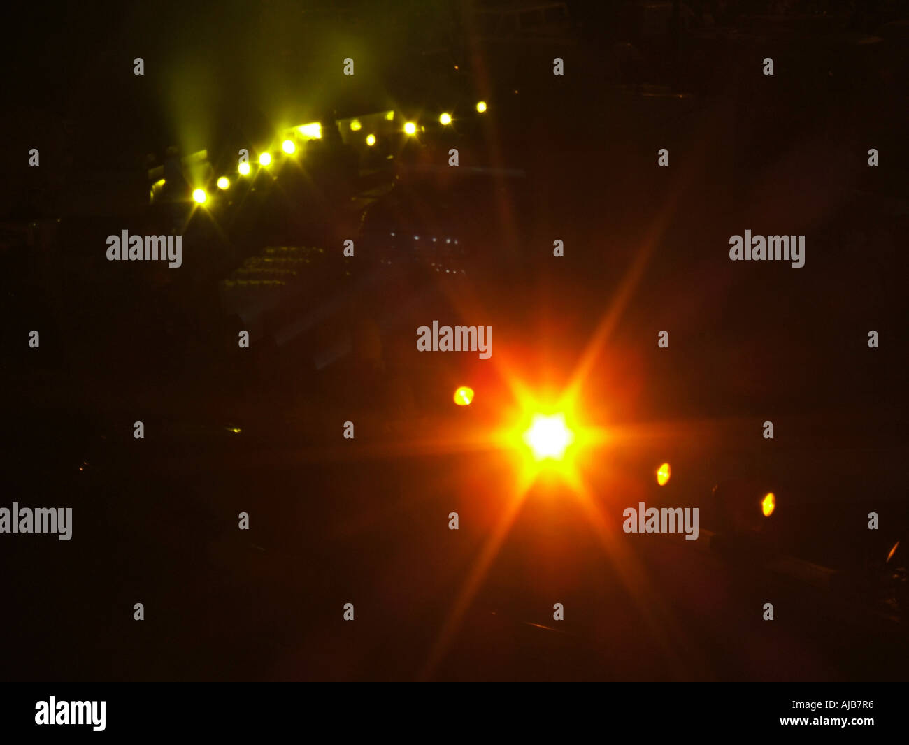 bright orange spotlight and dark background Stock Photo - Alamy