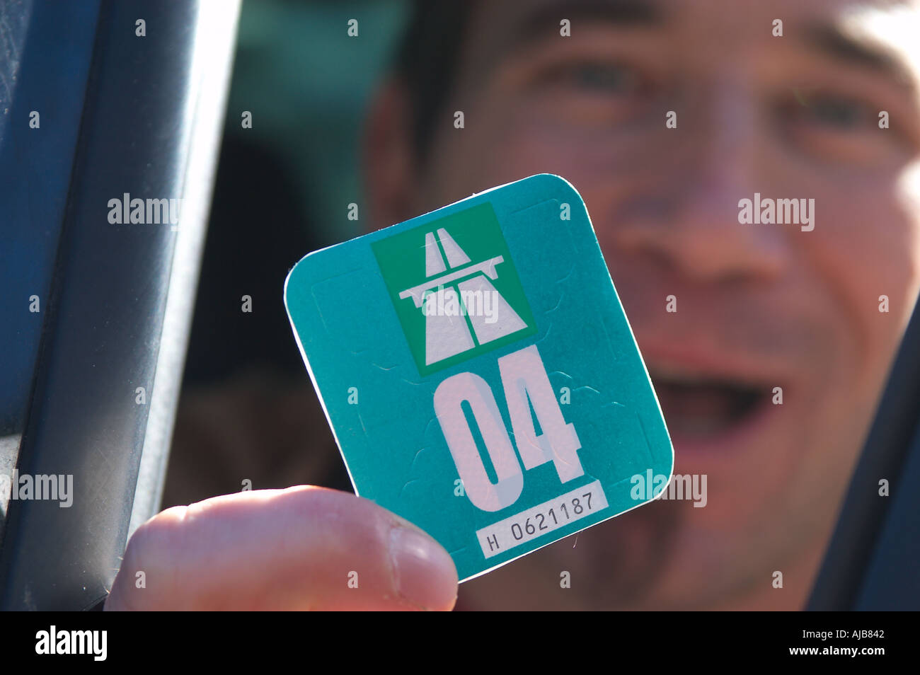 Motorist showing label for Motorway toll in Switzerland MR Stock Photo ...